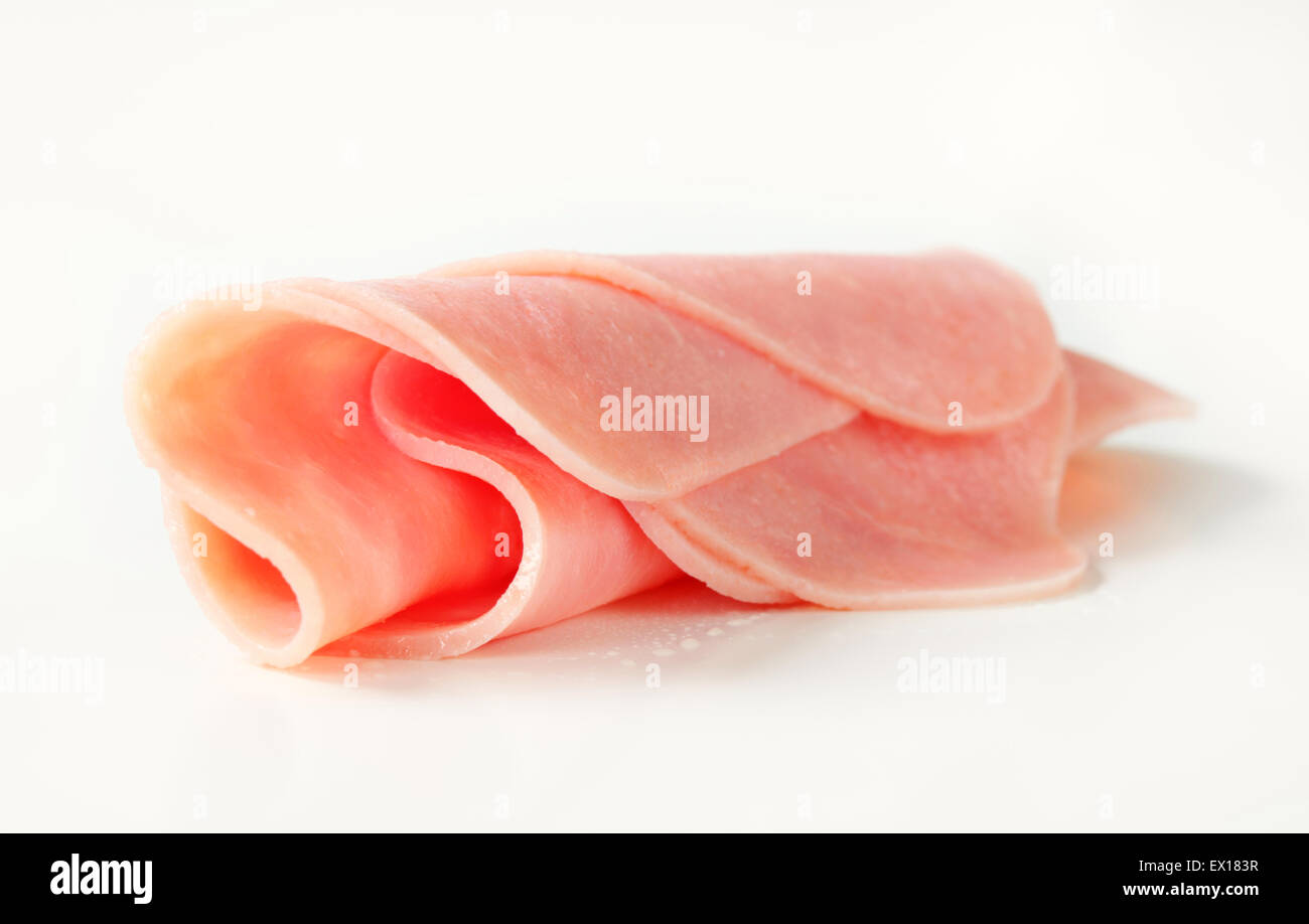 Studio shot of rolled slices of ham Stock Photo - Alamy
