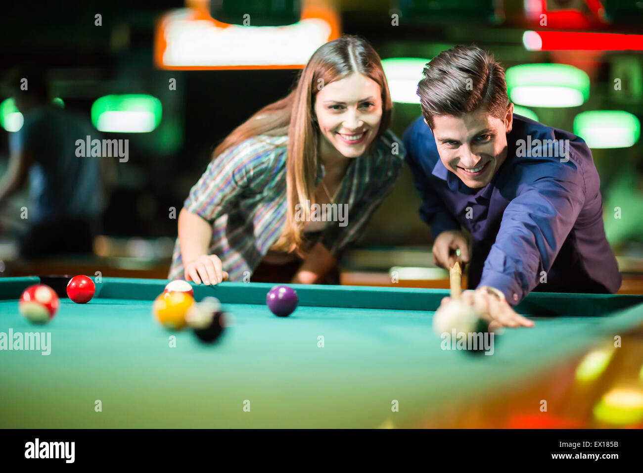 Young couple playing pool Stock Photo - Alamy