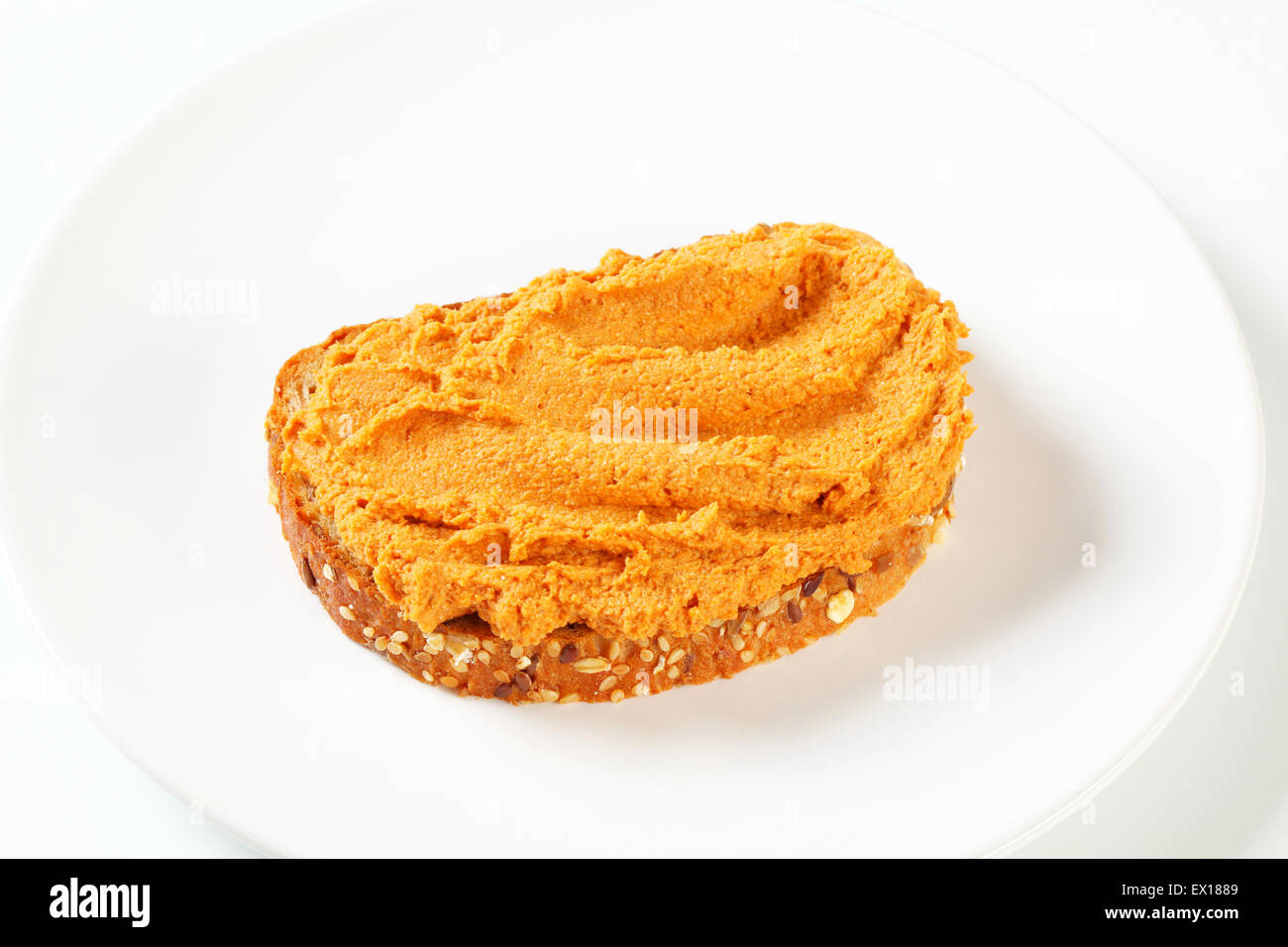 Whole grain bread with vegetable spread Stock Photo - Alamy