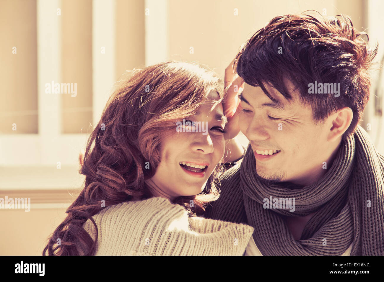 Dating young couple in love facing each other Stock Photo - Alamy