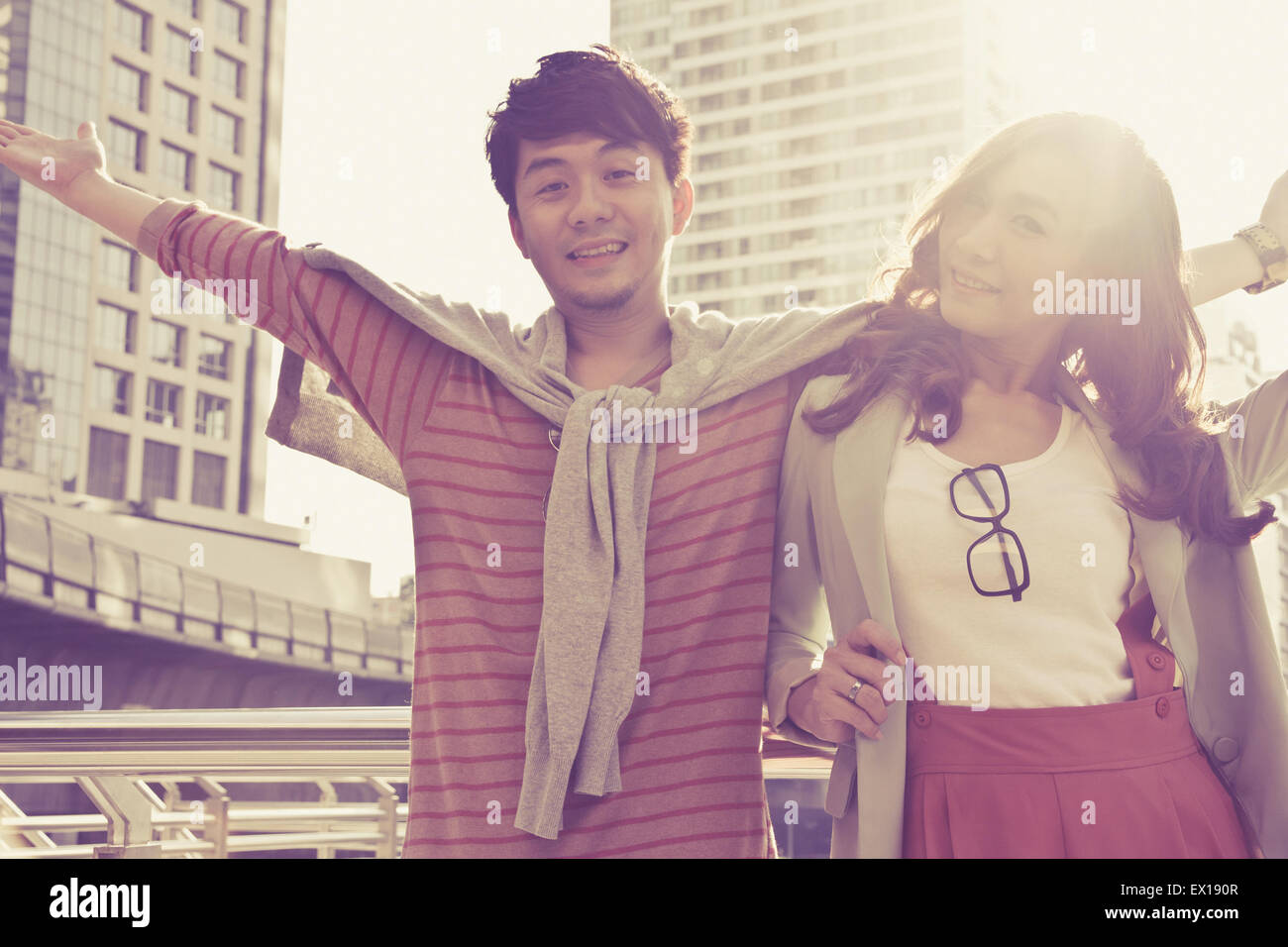 Young carefree couple laughing Stock Photo - Alamy