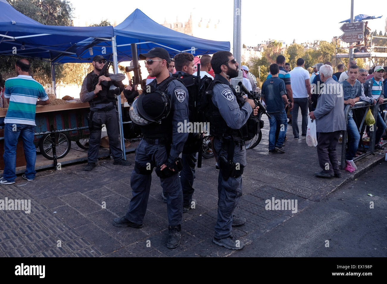 Armed Israeli policemen stand guard at the old city East Jerusalem ...