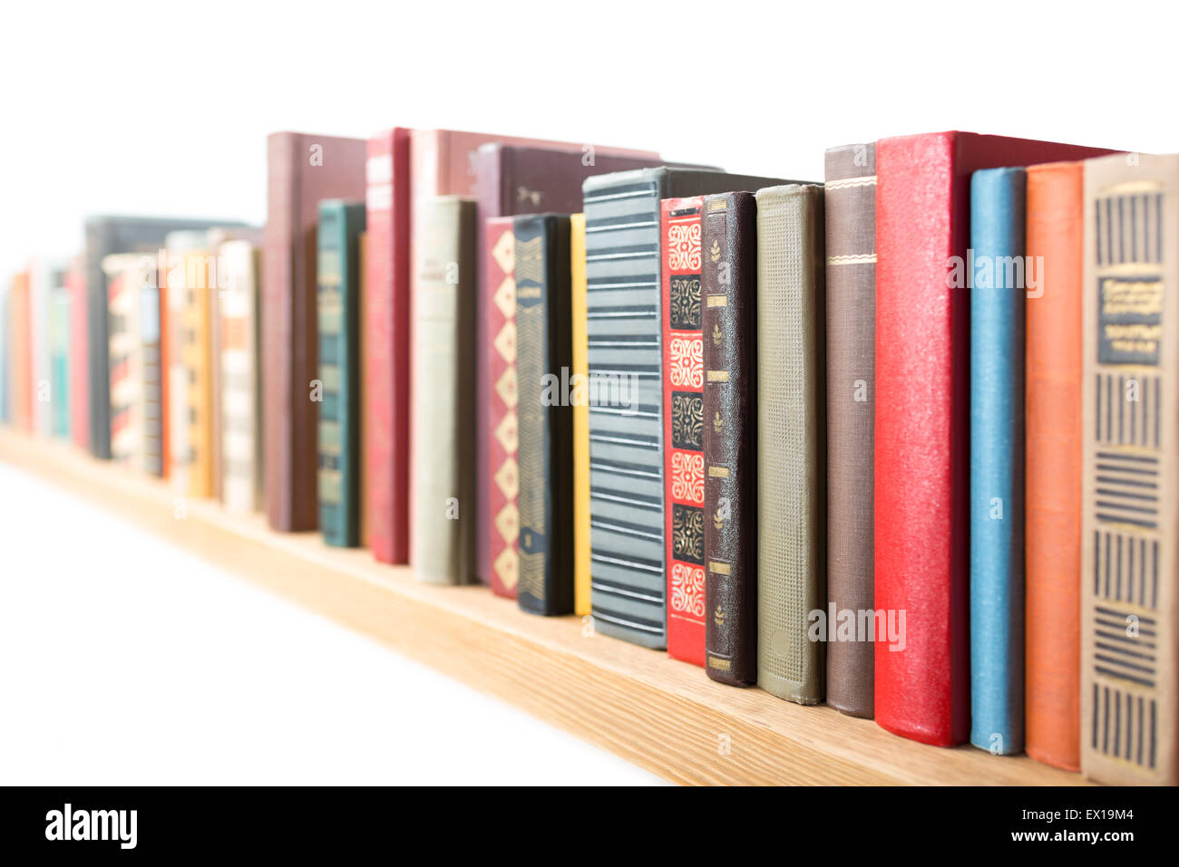 Books in a row. Shallow depth of field Stock Photo - Alamy