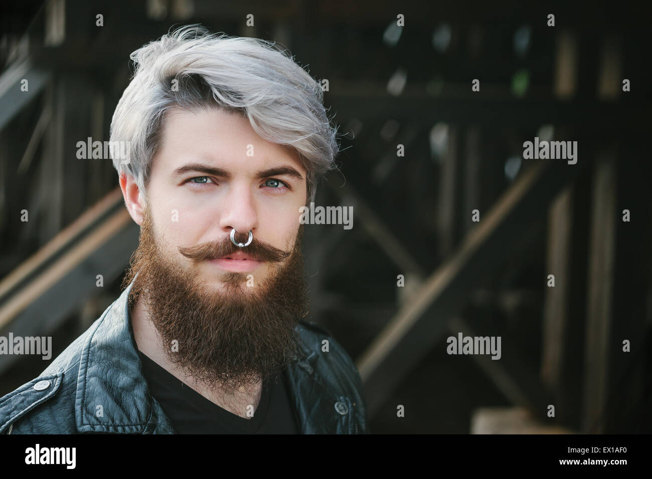 Bearded hipster with nose ring in leather jacket Stock Photo - Alamy