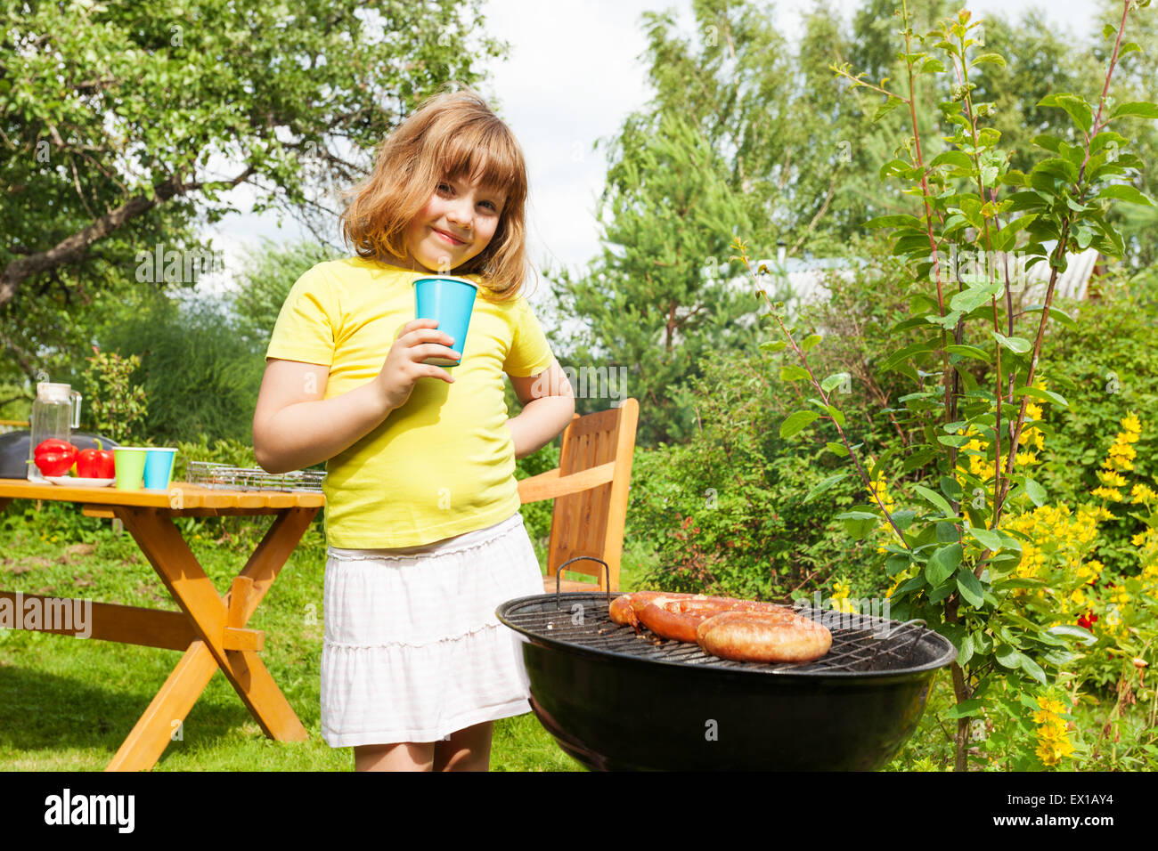 Children stand near table hi-res stock photography and images - Alamy