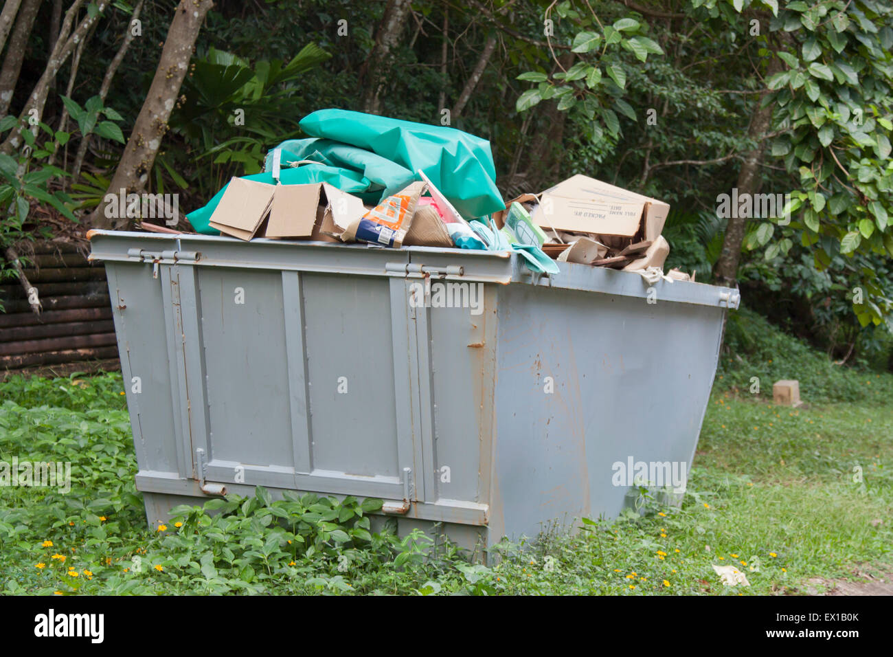 a tip skip bin filled with rubbish Stock Photo - Alamy