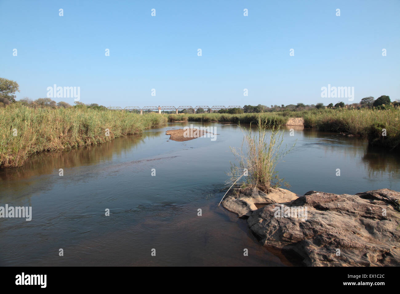 Sabie river in Kruger National Park, with historic train bridge in ...