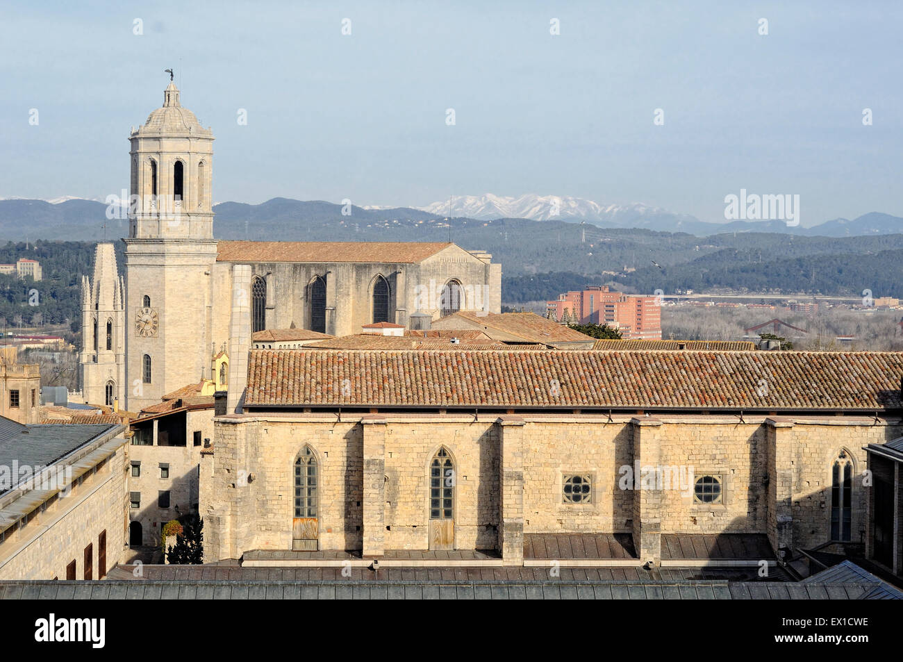 Saint Felix Cathedral in the oldtown with the pyrenees mountains at ...