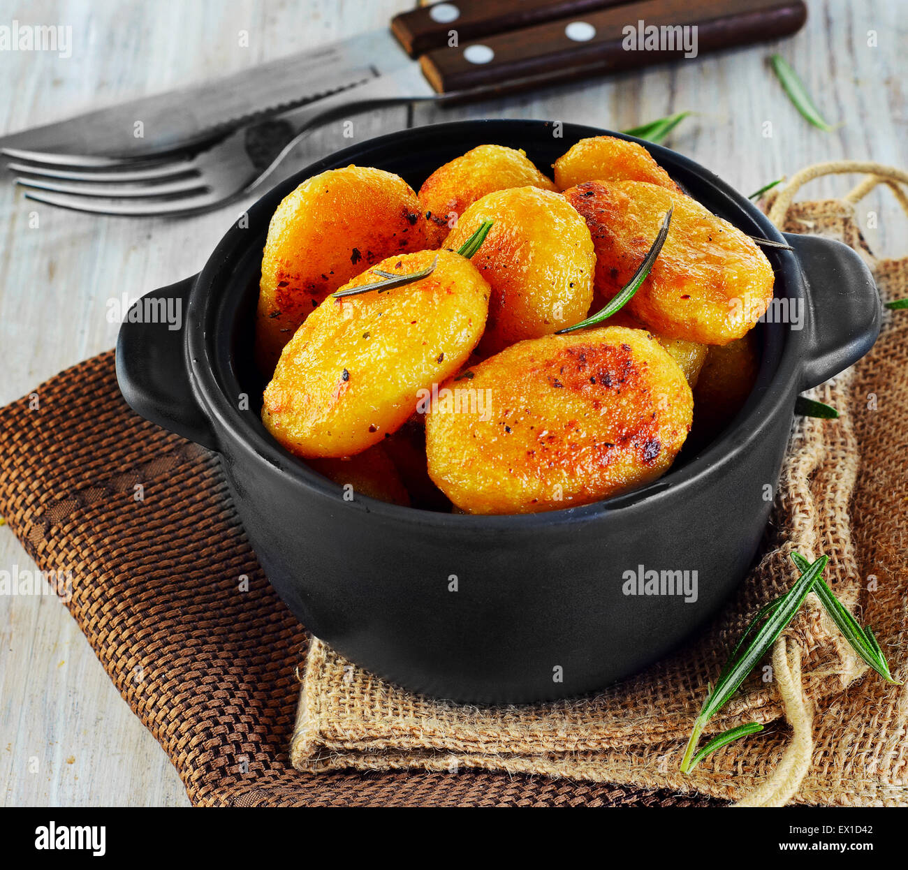Roasted homemade potatoes with rosemary. Selective focus Stock Photo ...