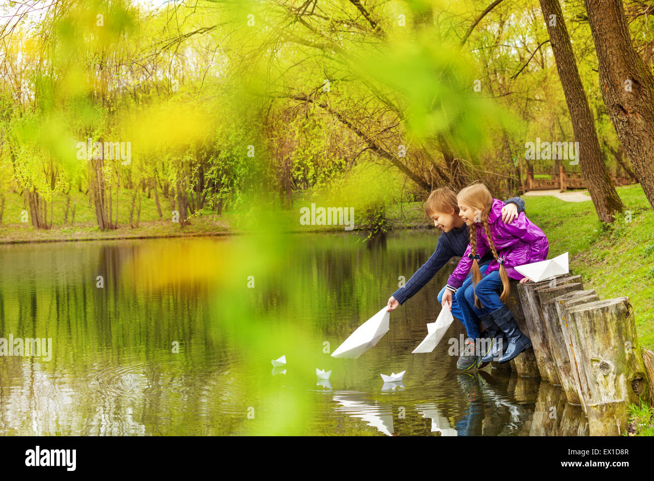 Two children playing near pond hi-res stock photography and images - Alamy