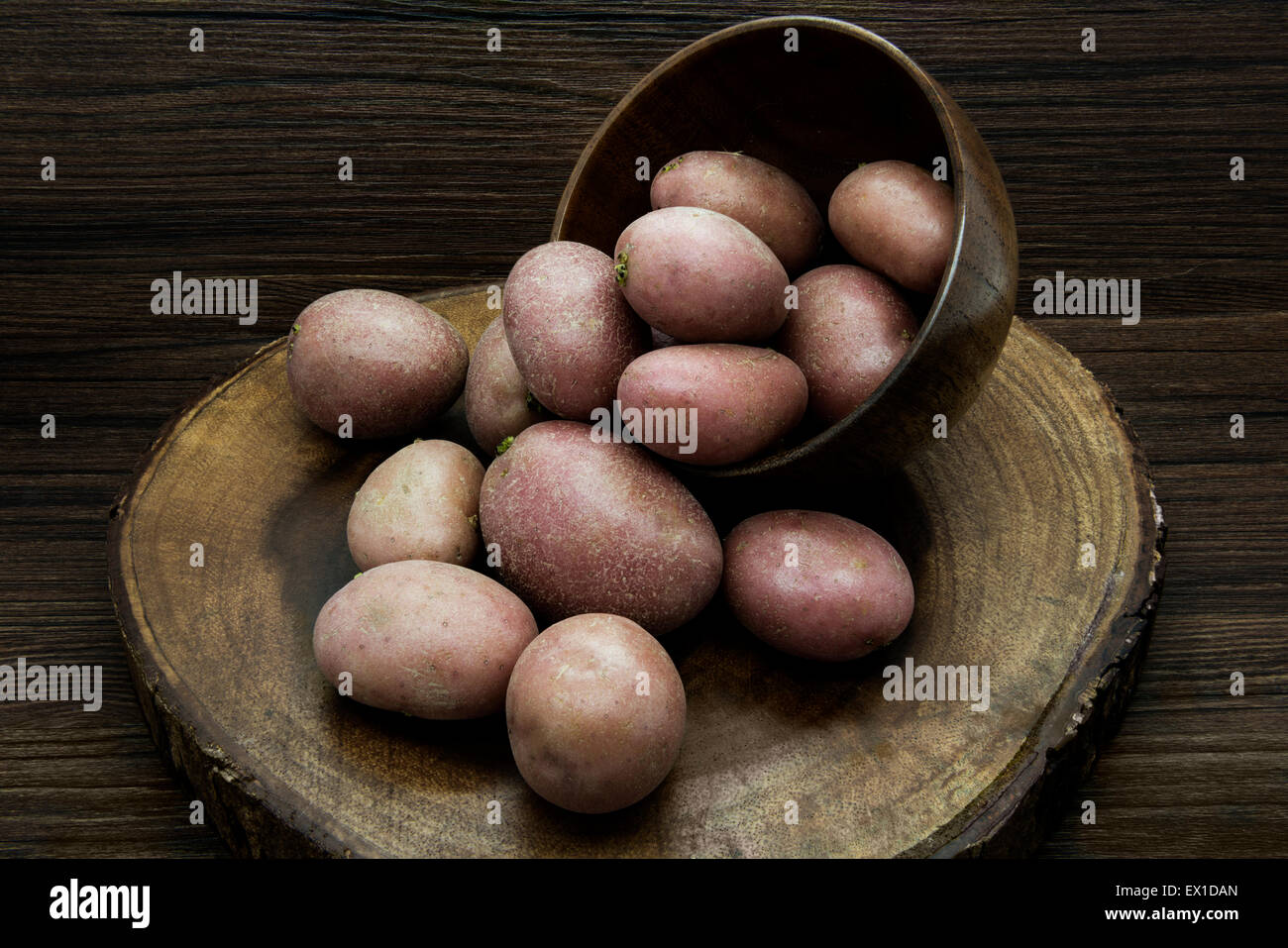 Potatoes on a rustic wooden background Stock Photo - Alamy