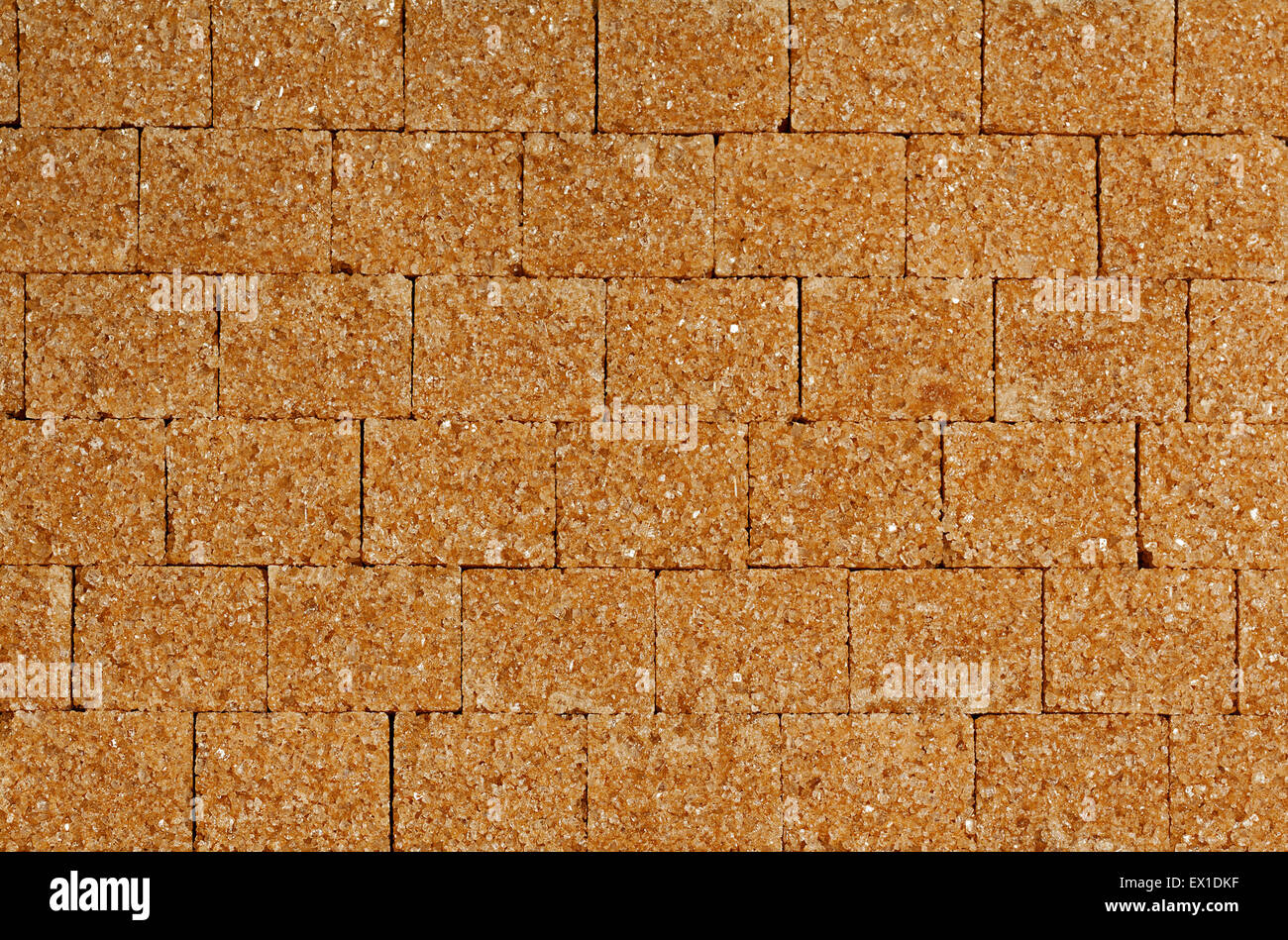 Thatched brown sugar cube stone background Stock Photo - Alamy
