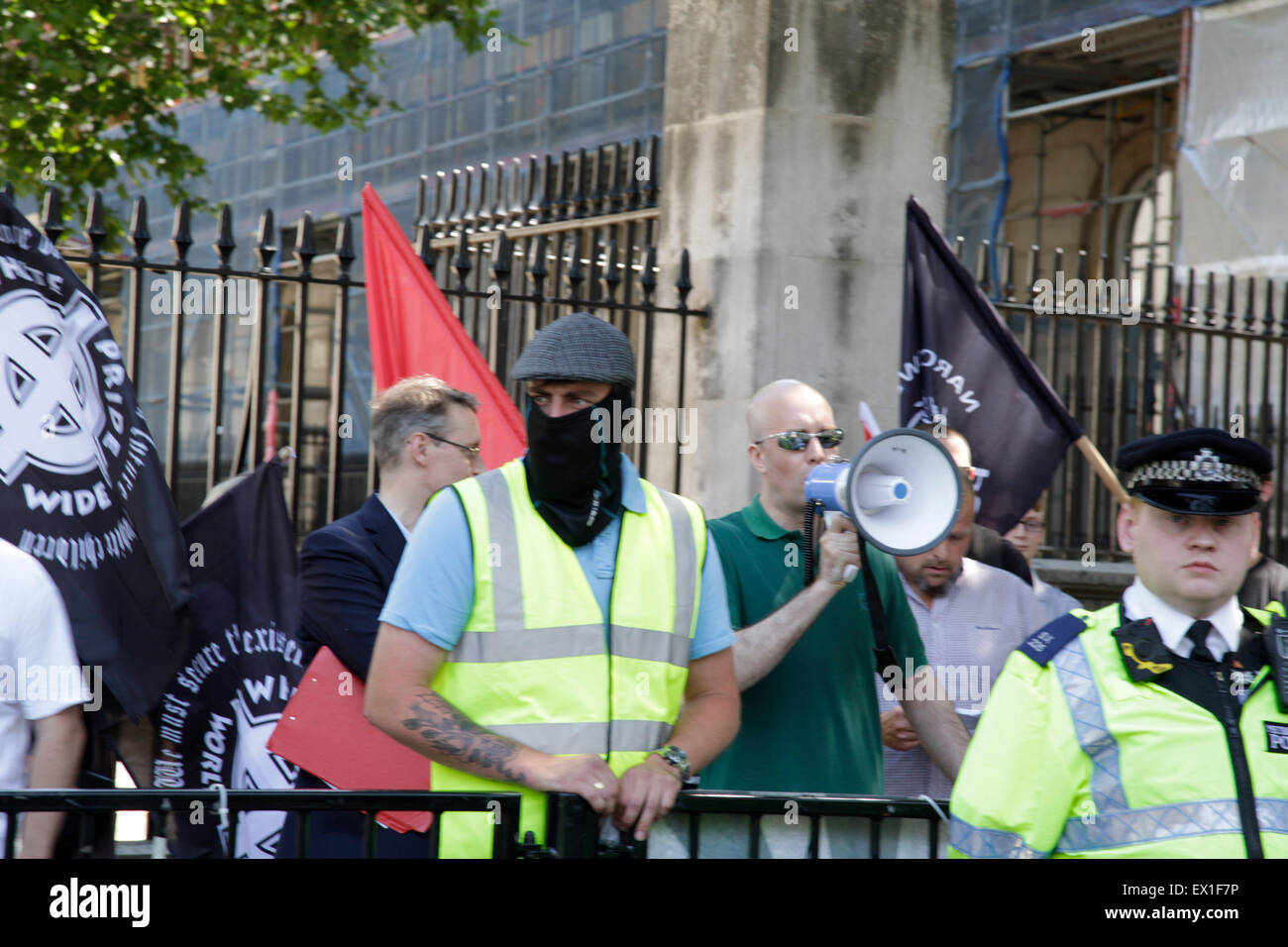 Westminster, London, UK, 4th July, 2015. A speaker at the protest ...