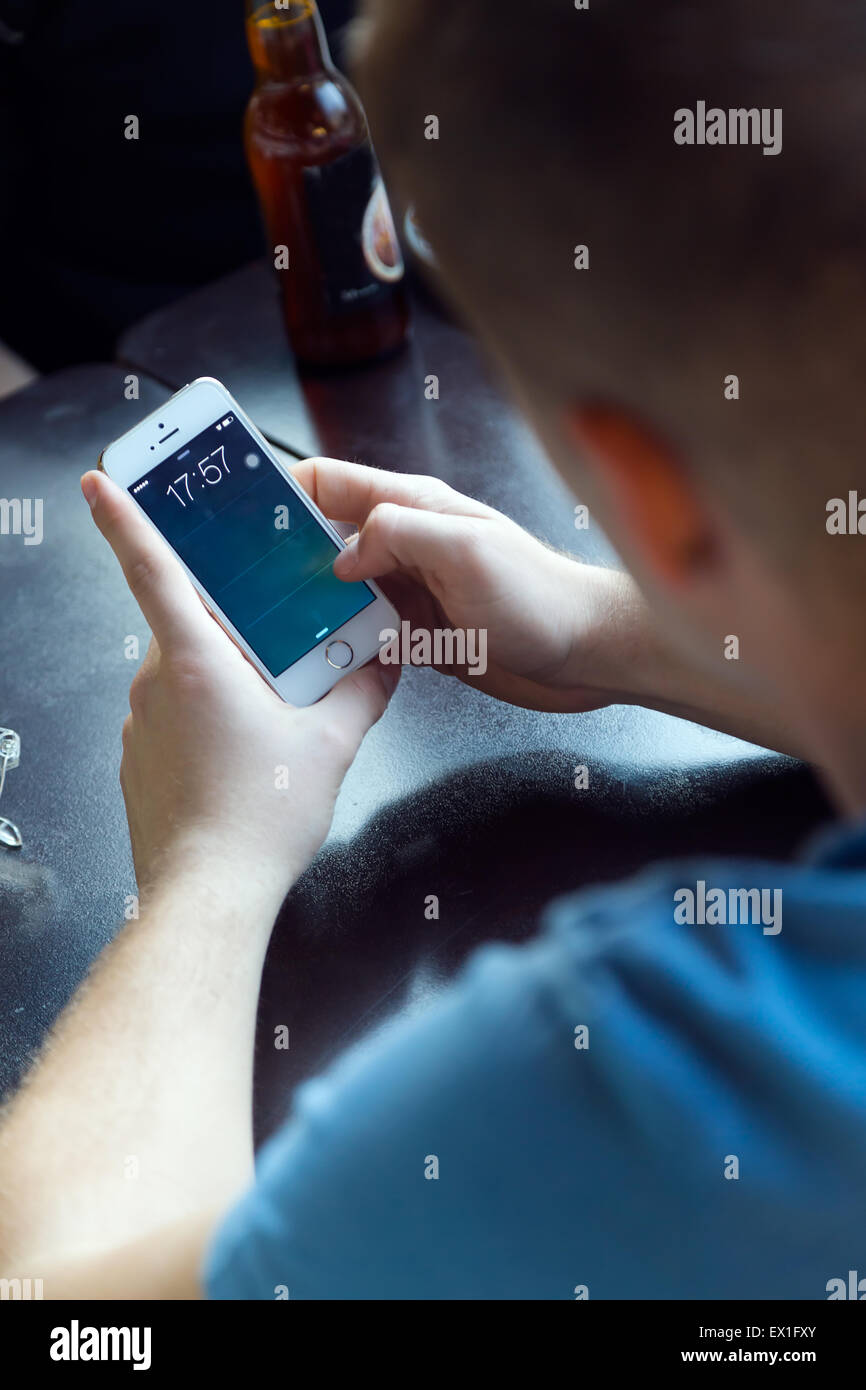 Portrait of group of friends using mobile phone in cafe Stock Photo - Alamy