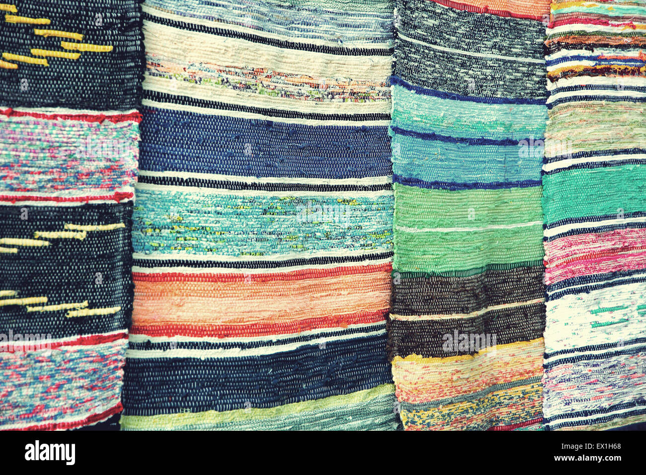 Multicolored handmade rugs as abstract background.Toned image Stock ...