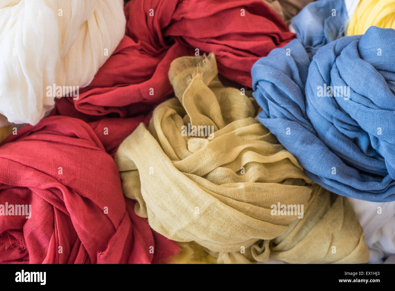 Stack of different colorfull tagelmust Stock Photo - Alamy