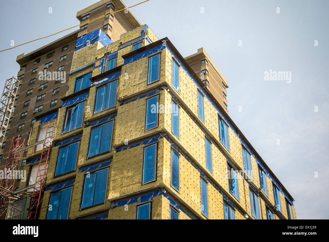 Construction on nARCHITECTS micro-unit modular apartments, branded ...
