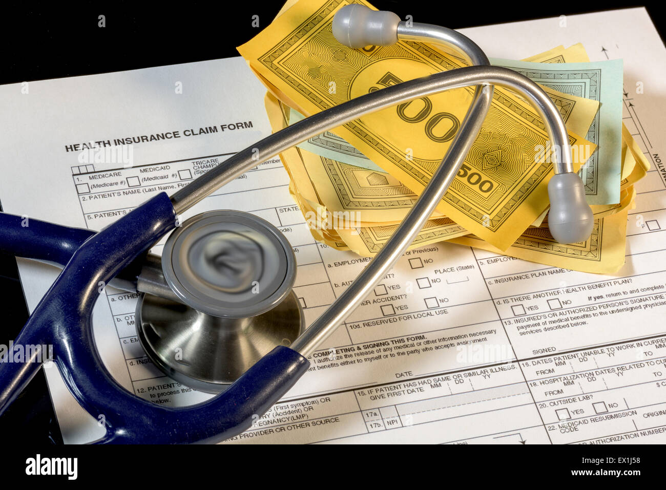 Health insurance forms on money Stock Photo - Alamy
