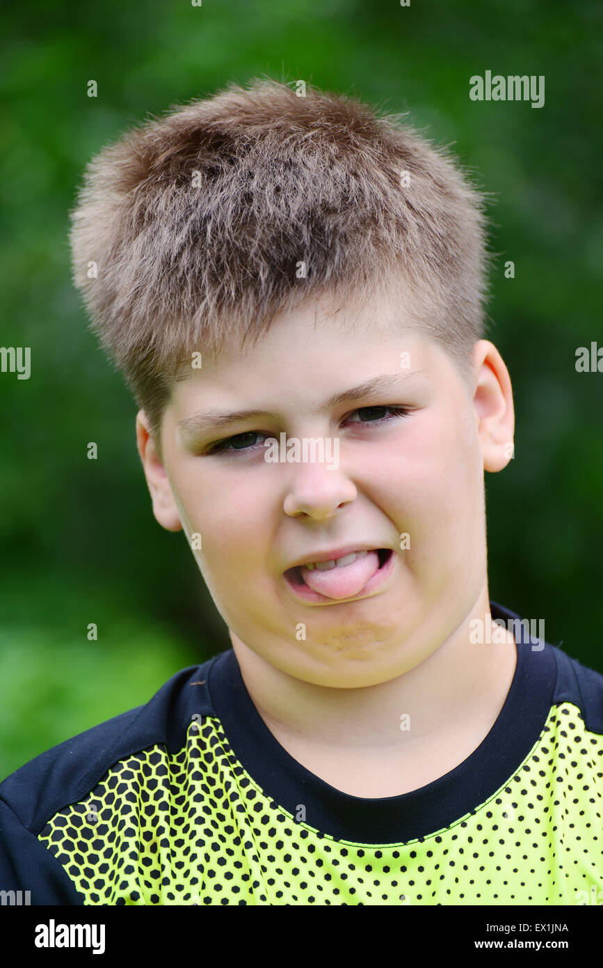 Portrait of a boy unhappy on the nature Stock Photo - Alamy