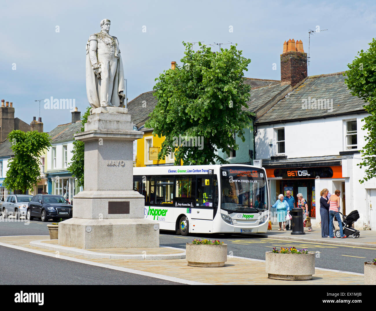 Bus picking up passengers in Cockermouth, Cumbria, England UK Stock ...