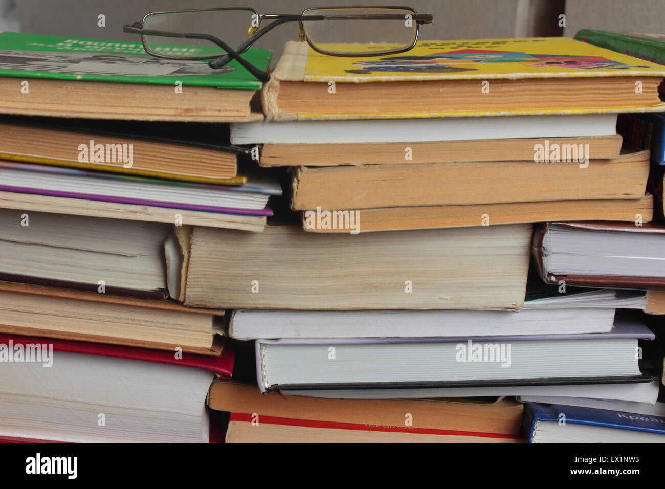 is a stack of old books and fascinating reading glasses Stock Photo - Alamy