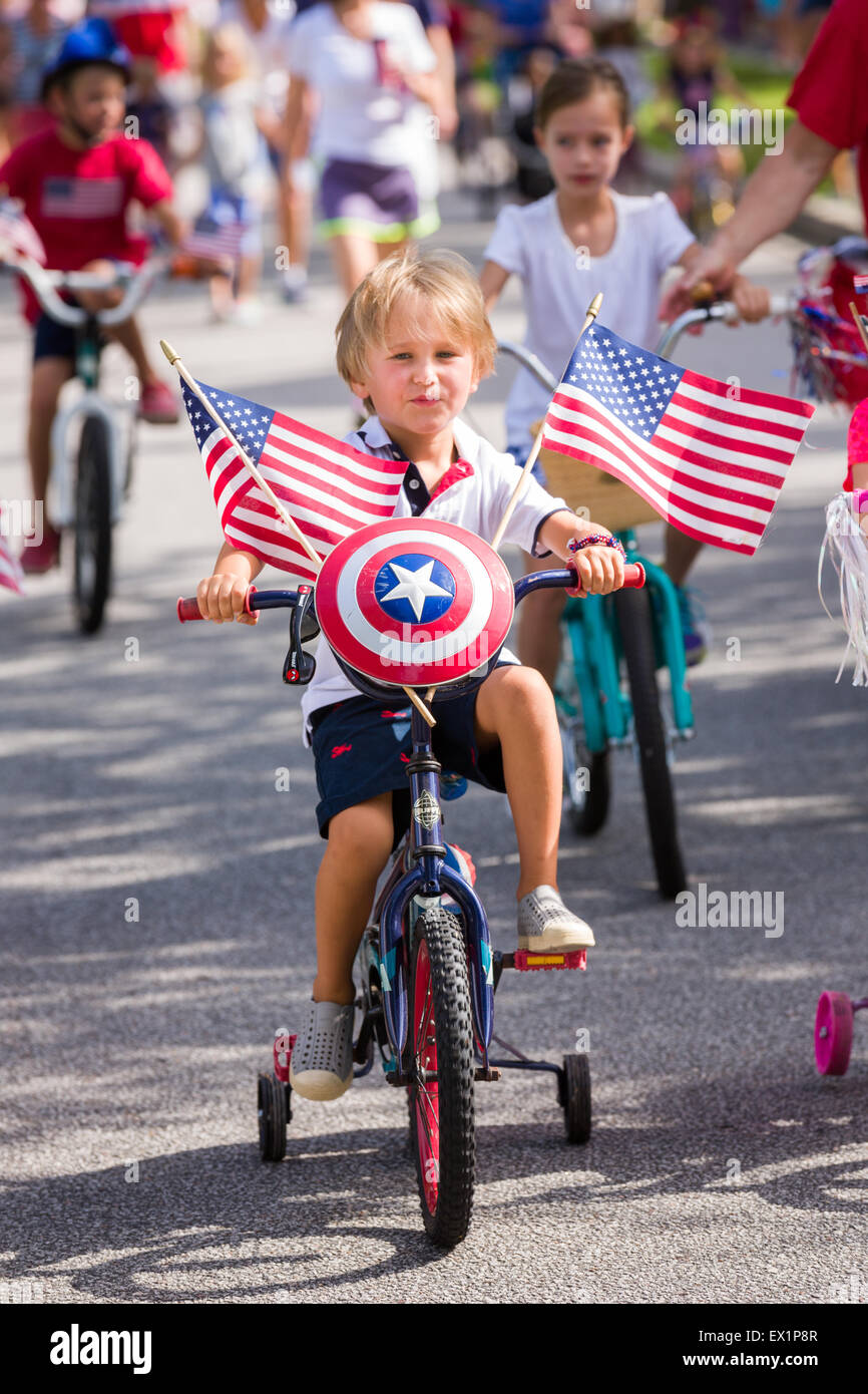 Parade costume boy bicycle flags hi-res stock photography and images ...