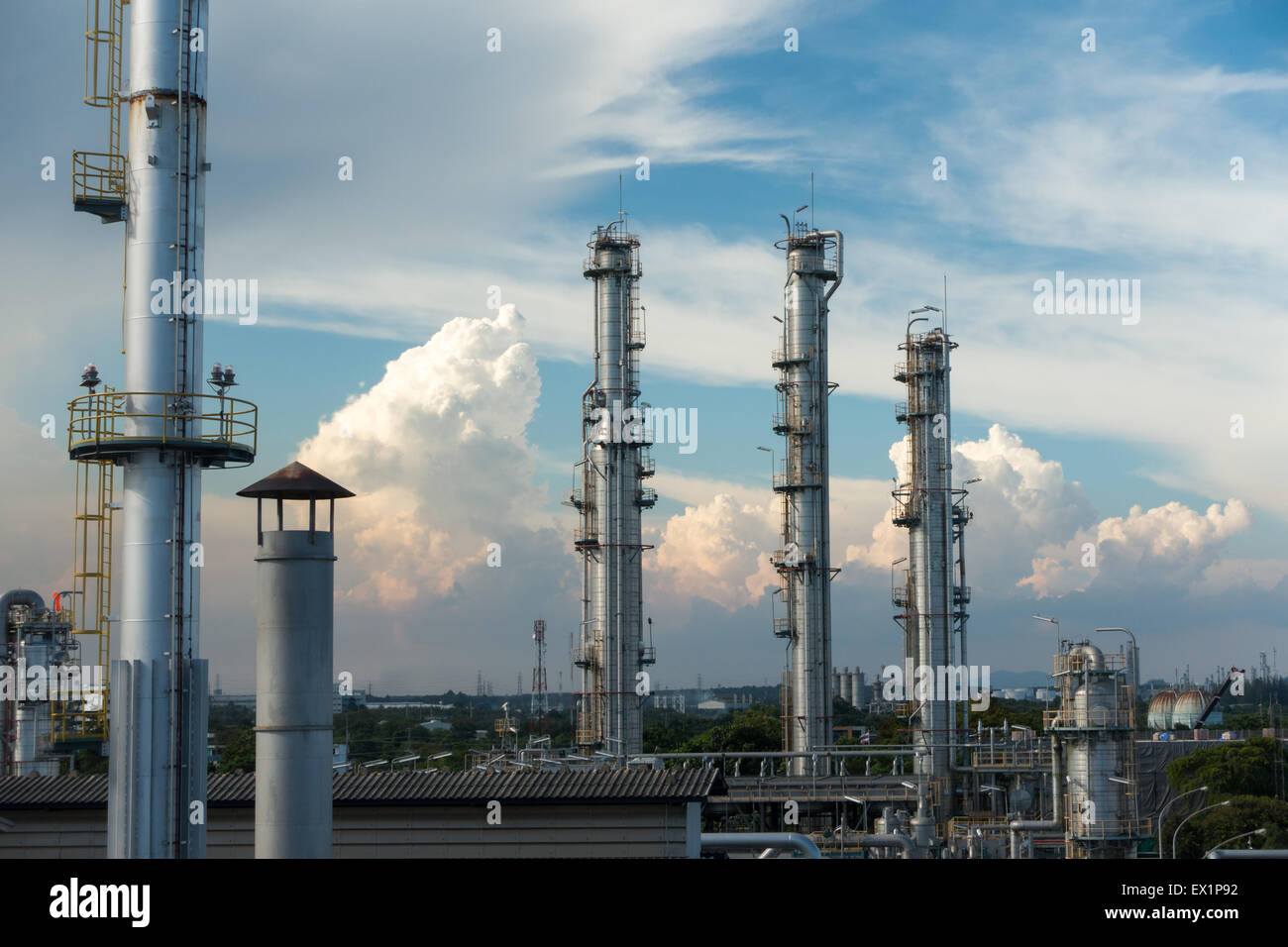 Process Columns of Natural Gas Plant with blue sky and cloud background ...