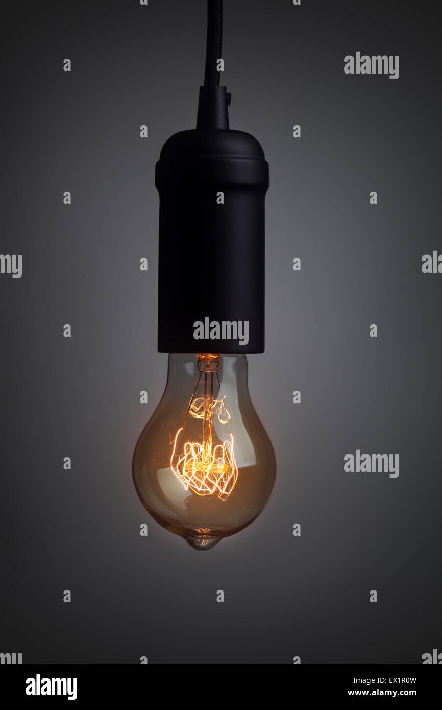 Vintage light bulb glowing Stock Photo - Alamy