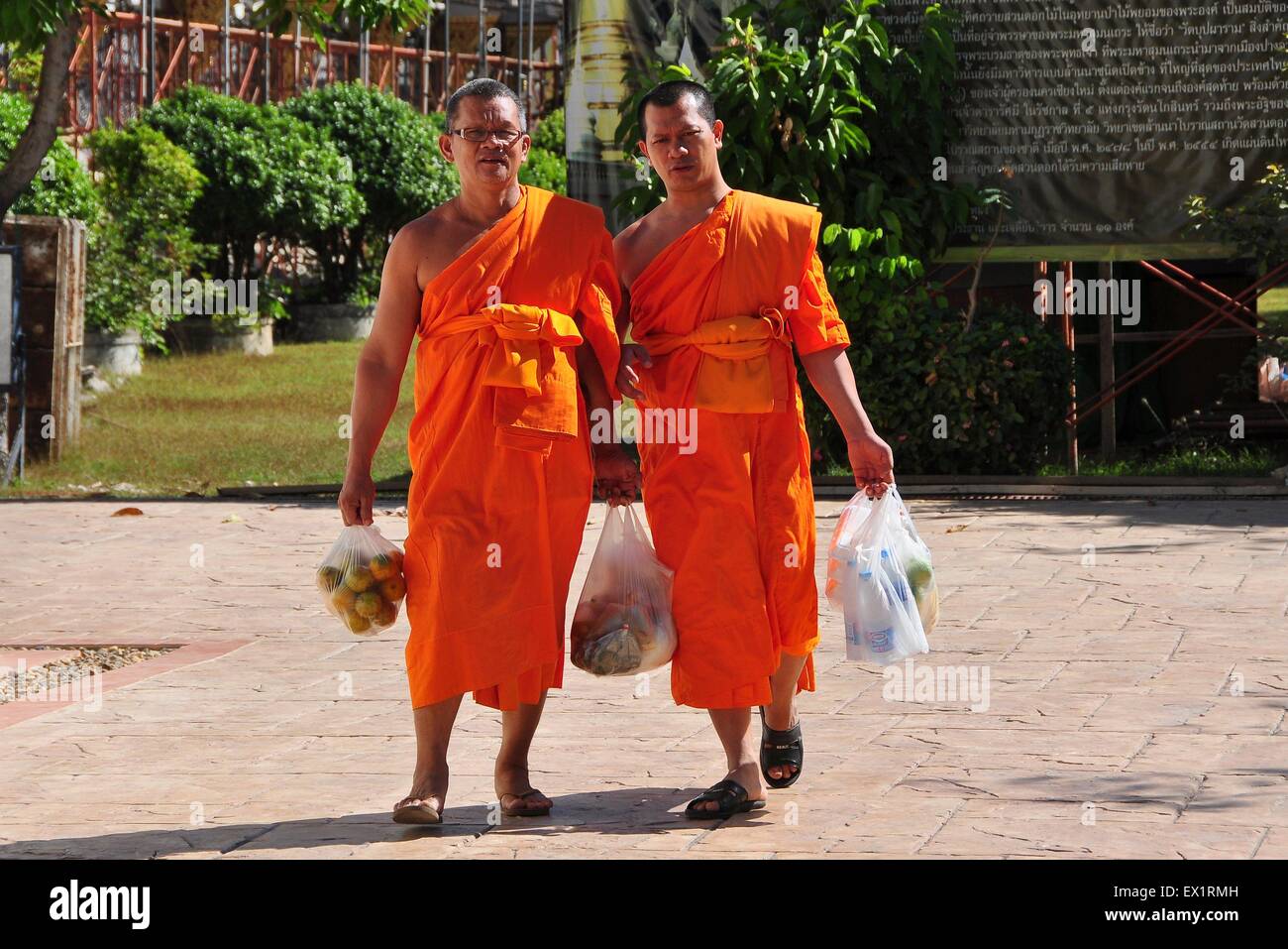 Chiang Mai, Thailand Two Buddhist monks in traditional orange wrap ...