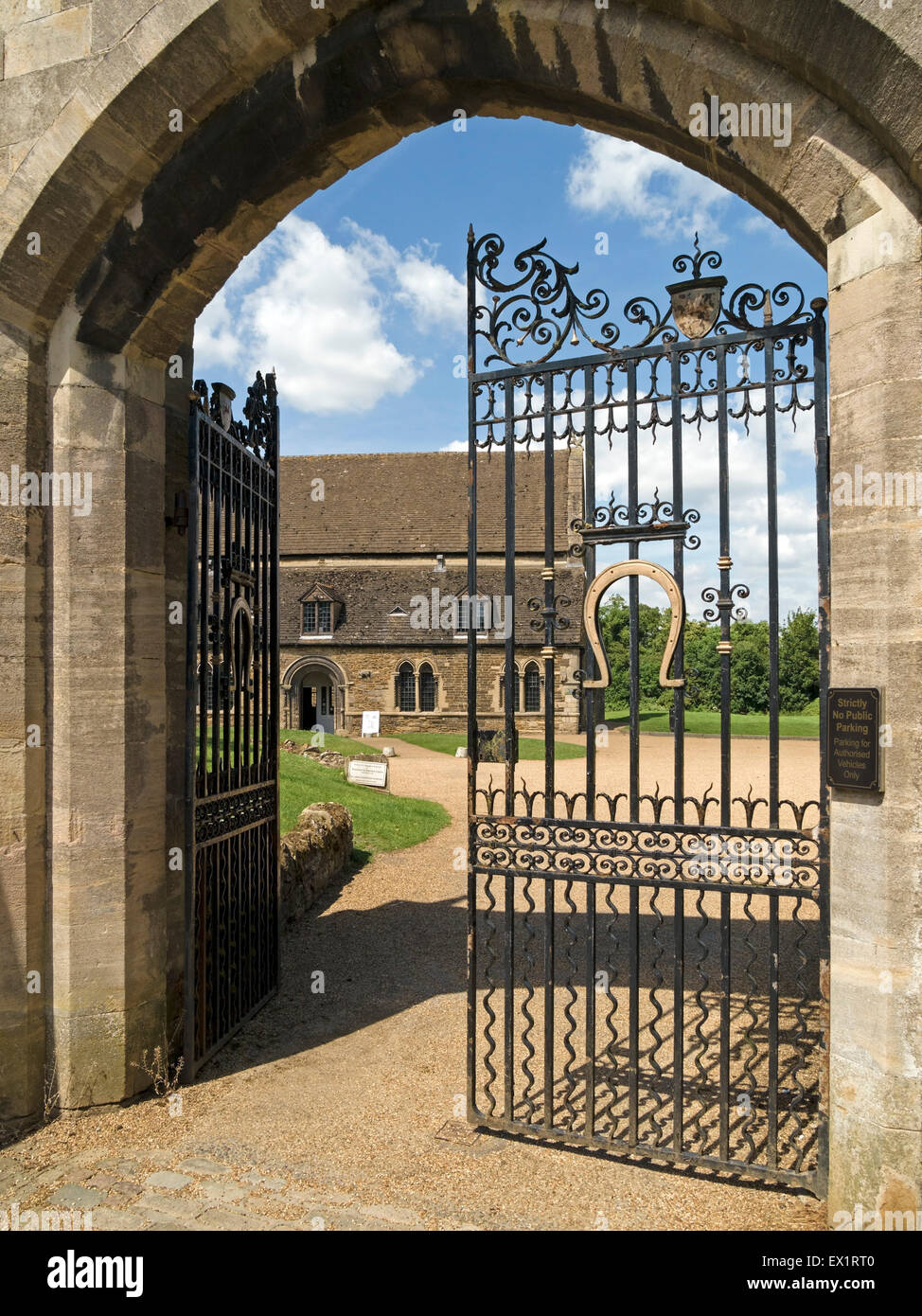 Wrought iron gates with golden horseshoes at entrance to Oakham Castle ...