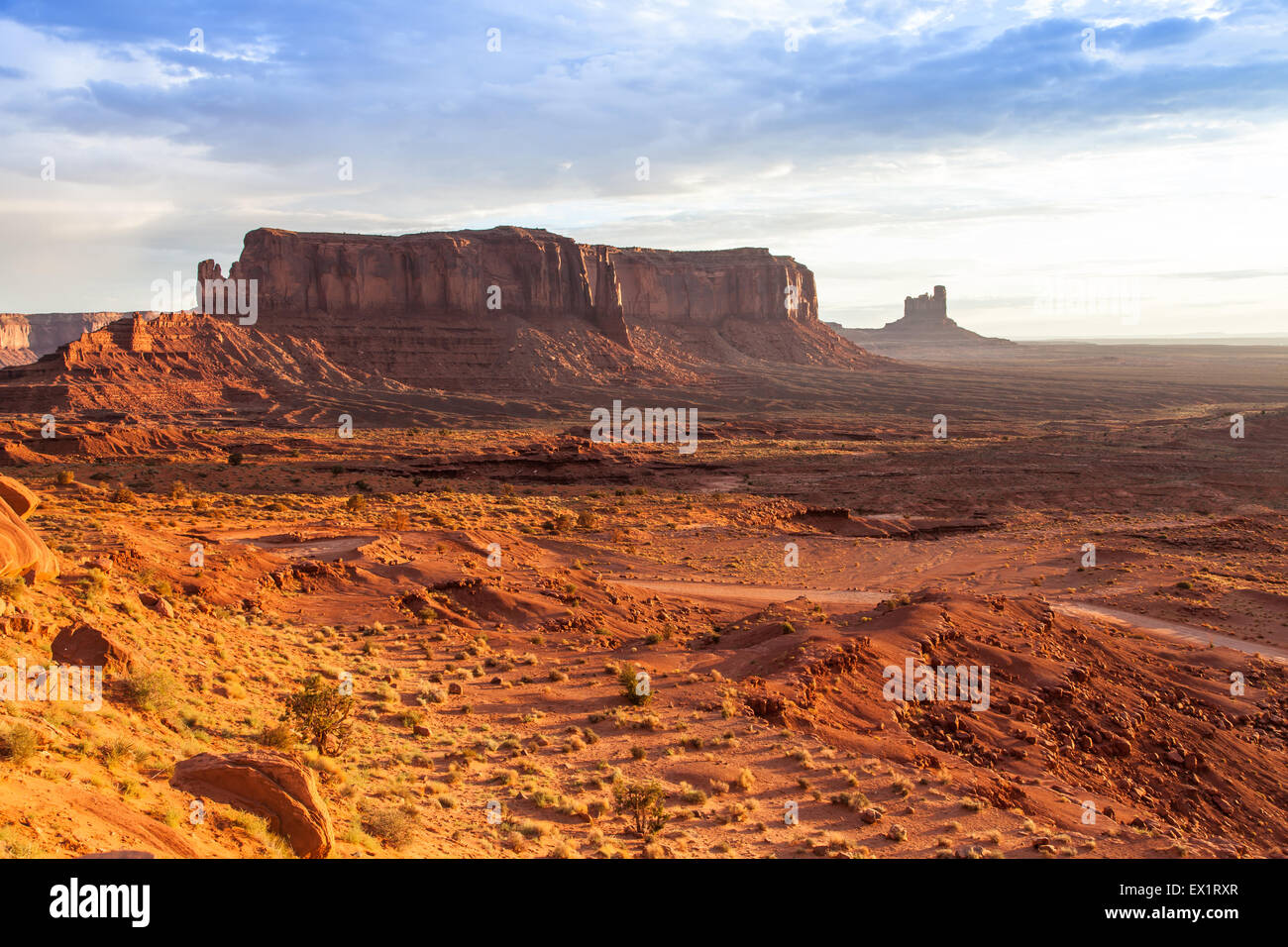 Orange colours during sunrise in this iconic view of Monument Valley ...