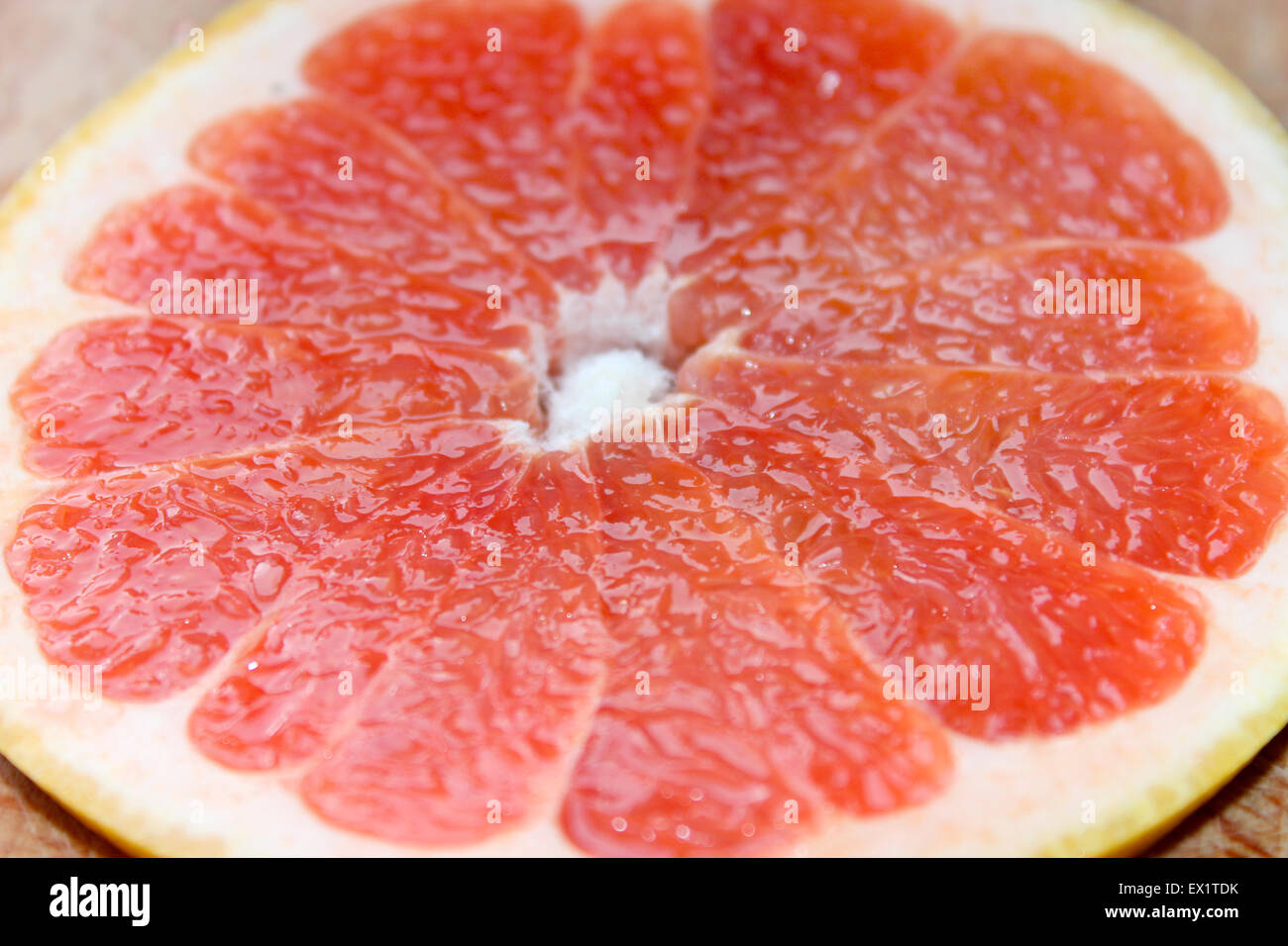 grapefruit bright red and cut by segments Stock Photo - Alamy