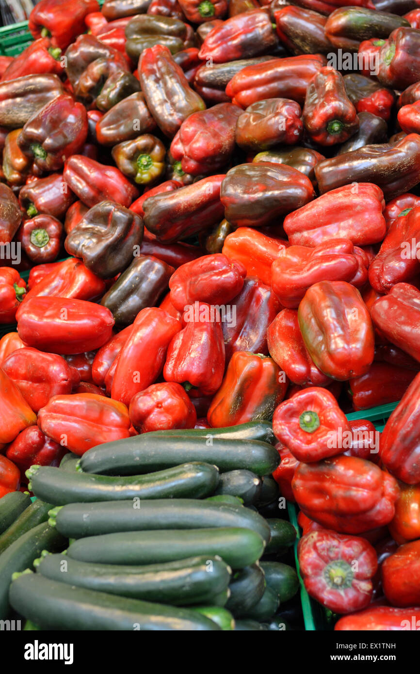 Bell peppers and courgettes on display in supermarket Stock Photo - Alamy