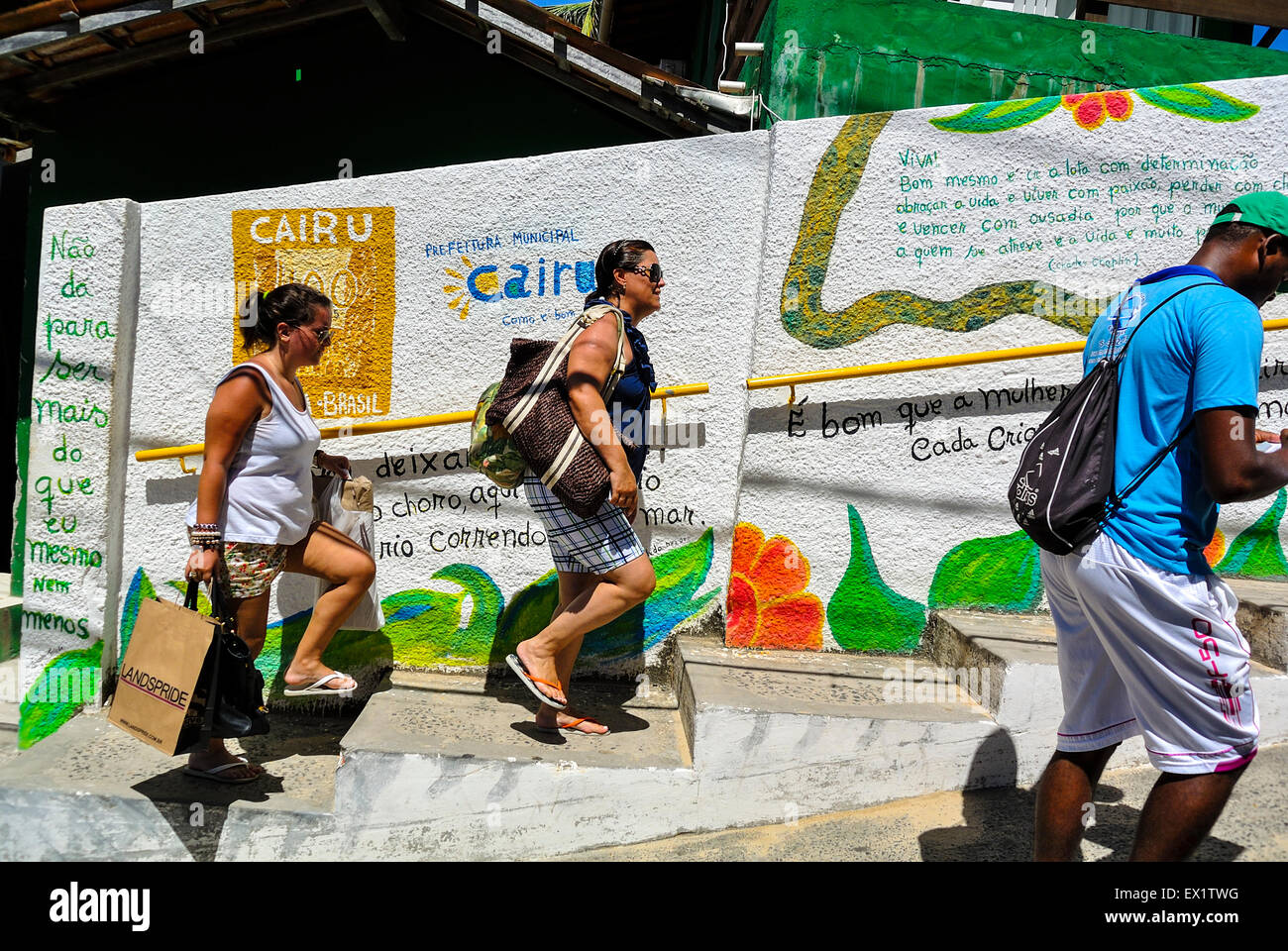 Brazilian tourists walking in the street, Morro de sao paulo, Salvador ...