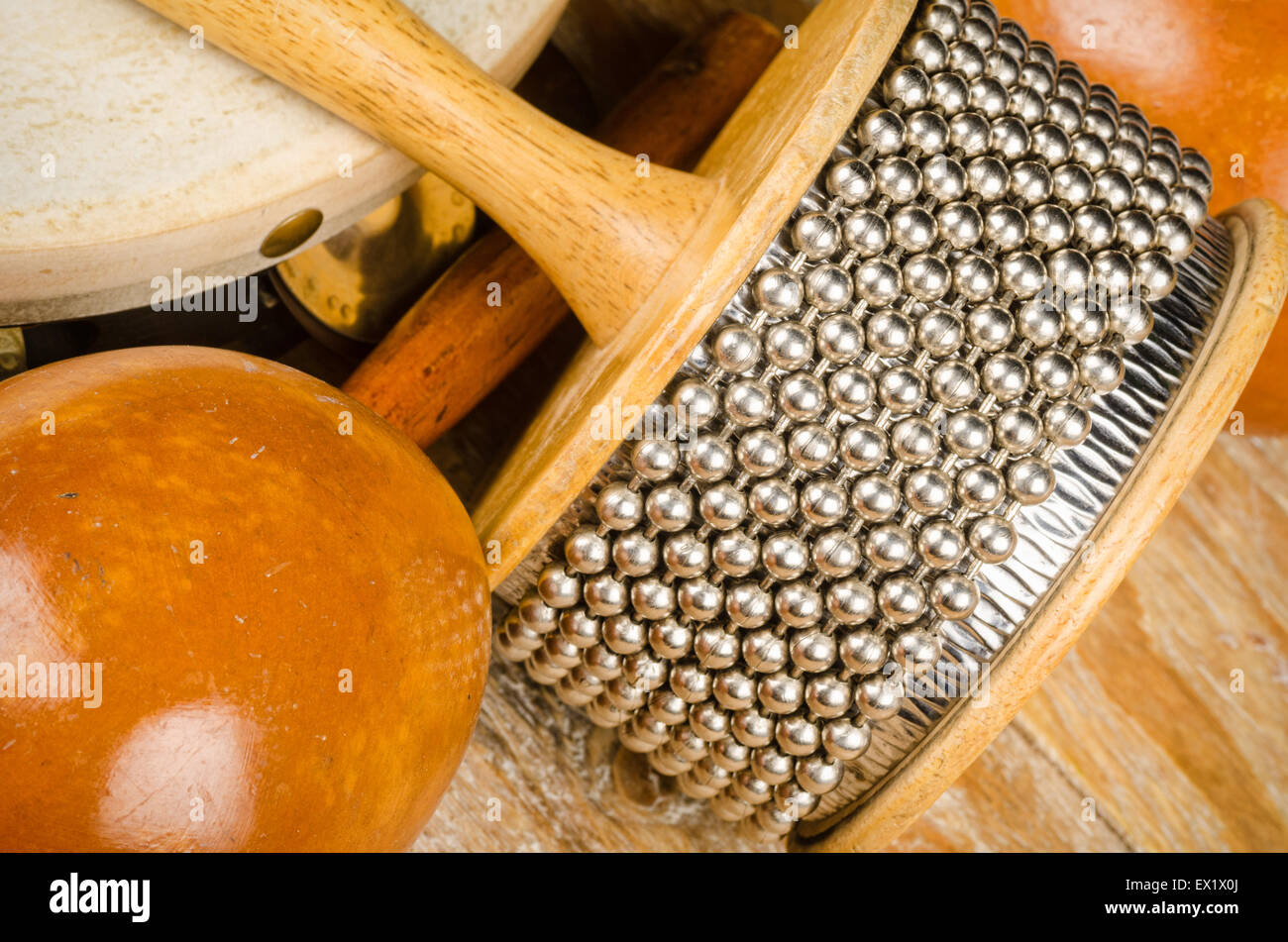 Several small percussion instruments on a rustic wooden surface Stock ...