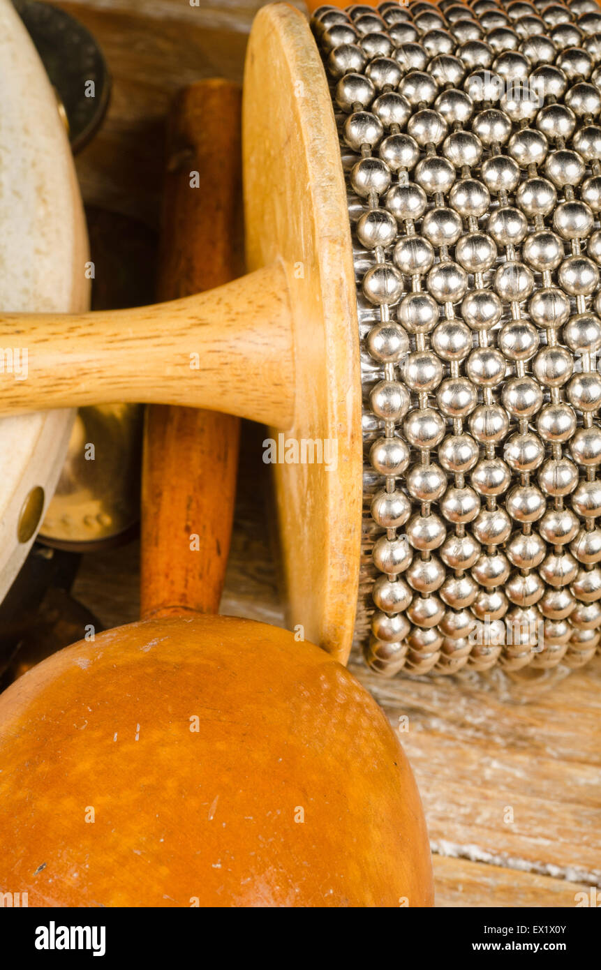 Several small percussion instruments on a rustic wooden surface Stock ...