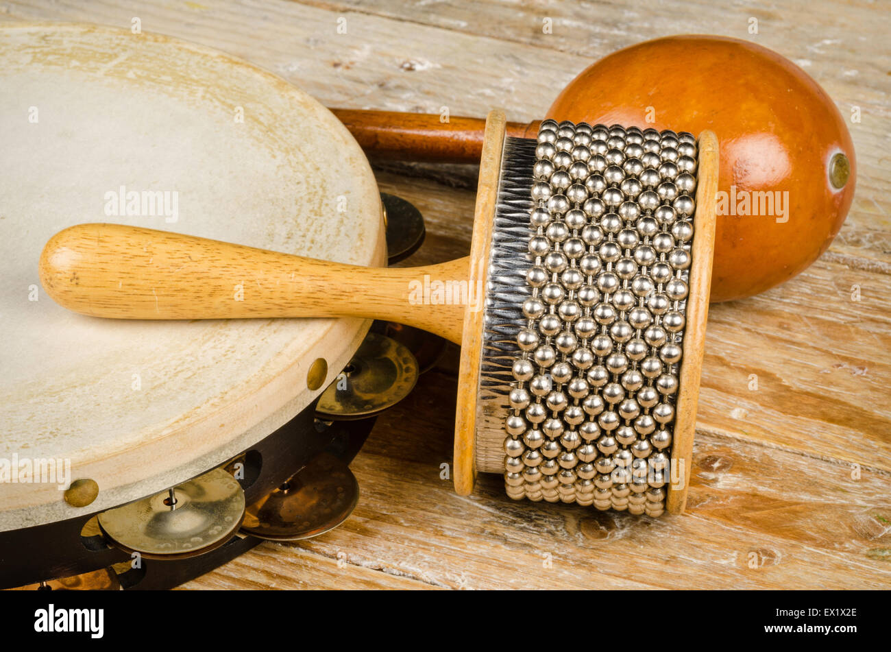 Several small percussion instruments on a rustic wooden surface Stock ...