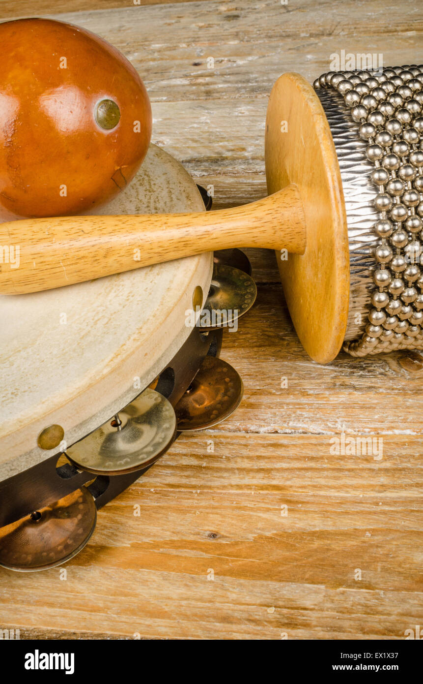 Several small percussion instruments on a rustic wooden surface Stock ...