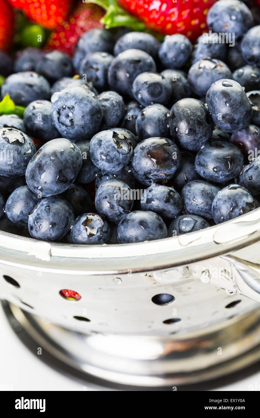 Colander with washed organic berries Stock Photo - Alamy