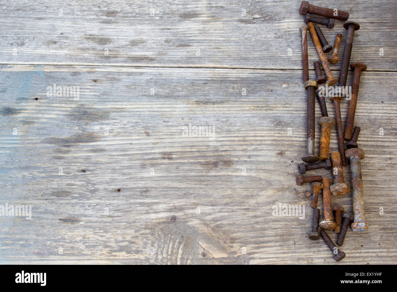 Old bolts or dirty bolts on wooden background, Machine equipment in ...