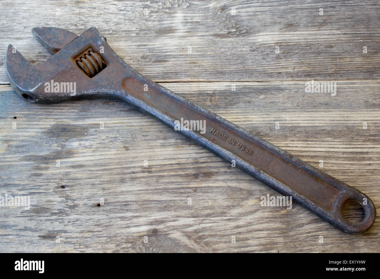 old vintage retro used open-end wrenches on wooden table, rusty wrench ...
