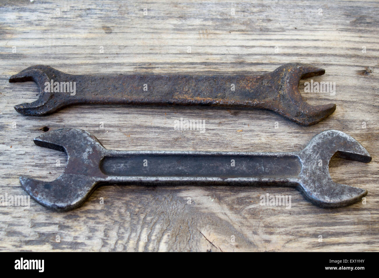 old vintage retro used open-end wrenches on wooden table Stock Photo ...