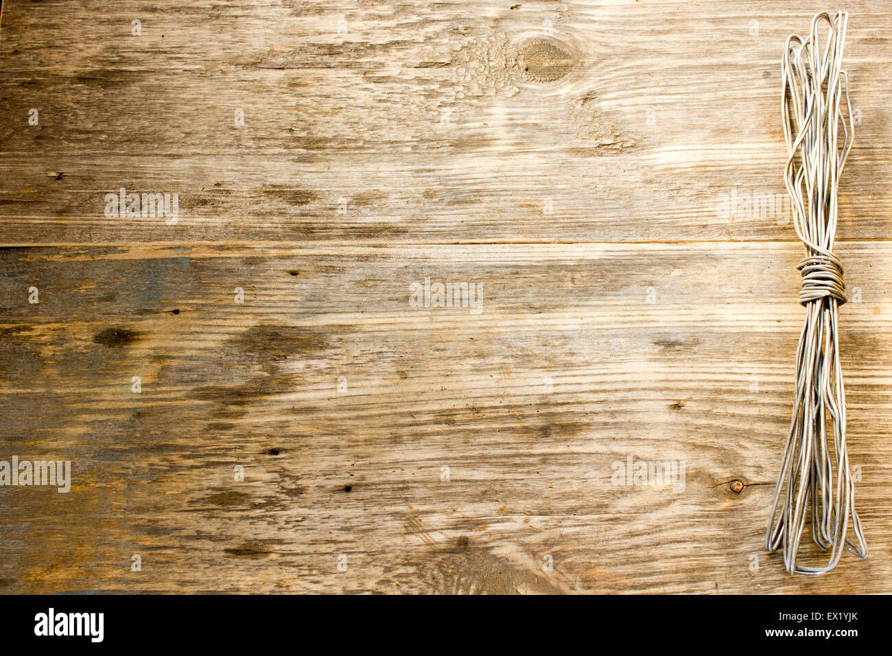 Rope and Textured Wood, Coil of rope set against highly textured wood ...