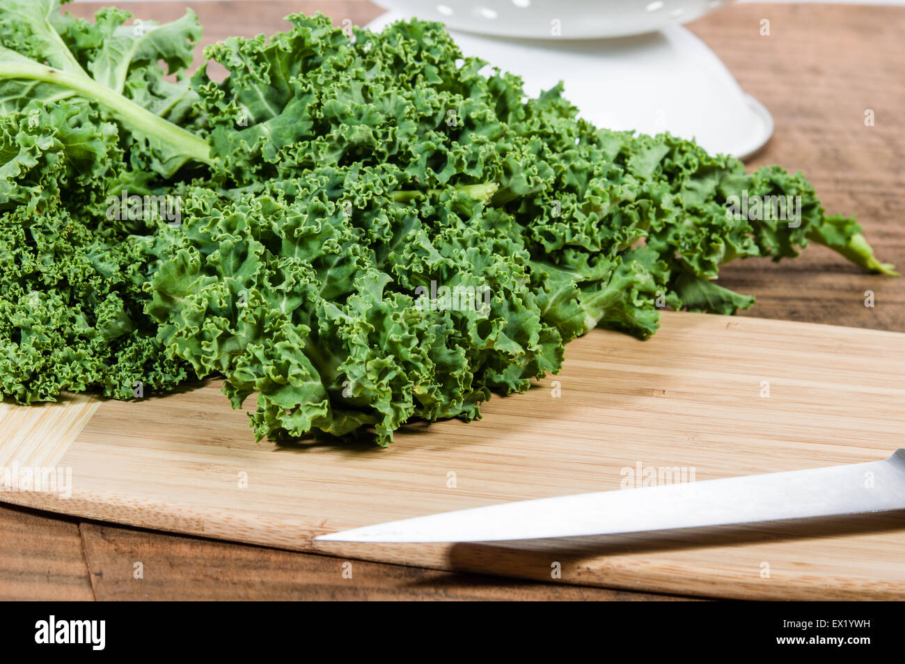Green curly kale and chef knife Stock Photo - Alamy