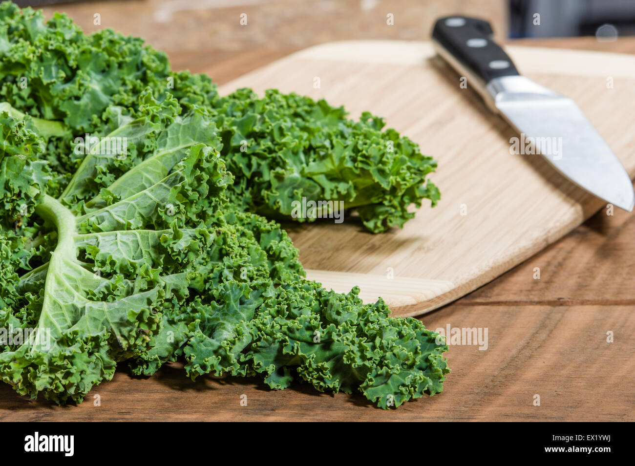 Green curly kale and chef knife Stock Photo - Alamy