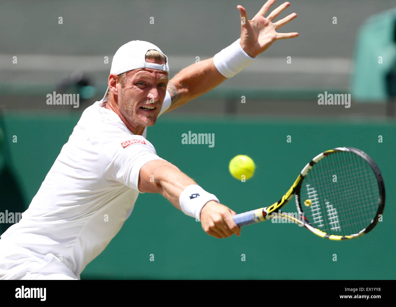 Wimbledon. 4th July, 2015. Sam Groth of Australia returns a ball during ...