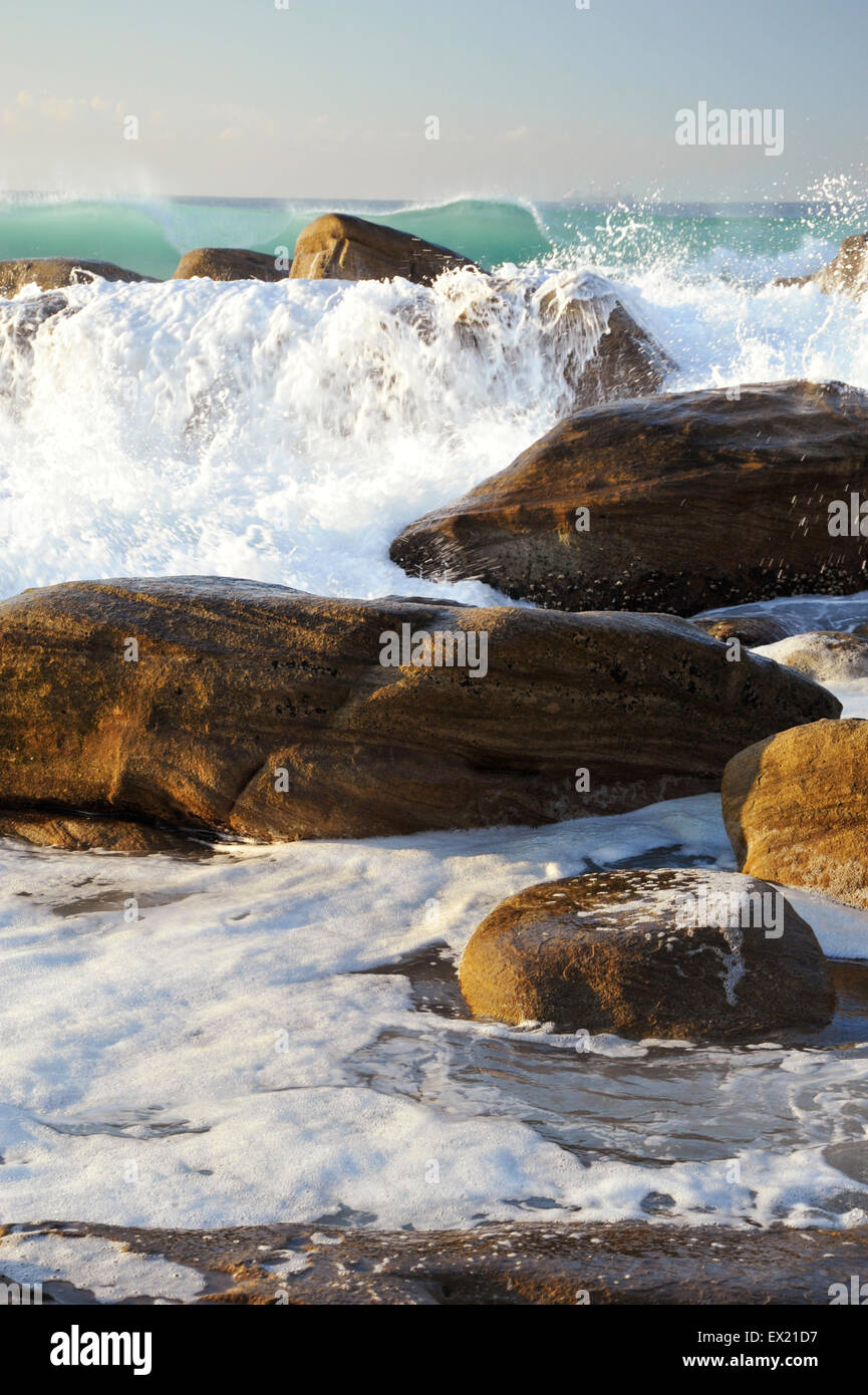 Waves spilling over rocks hi-res stock photography and images - Alamy