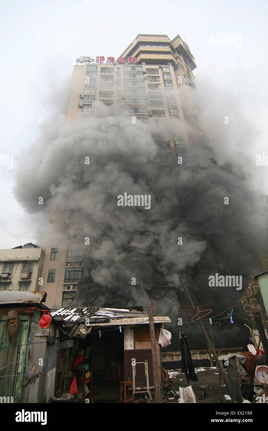 A fire is seen on a commercial building in Wuhan, Hubei province ...