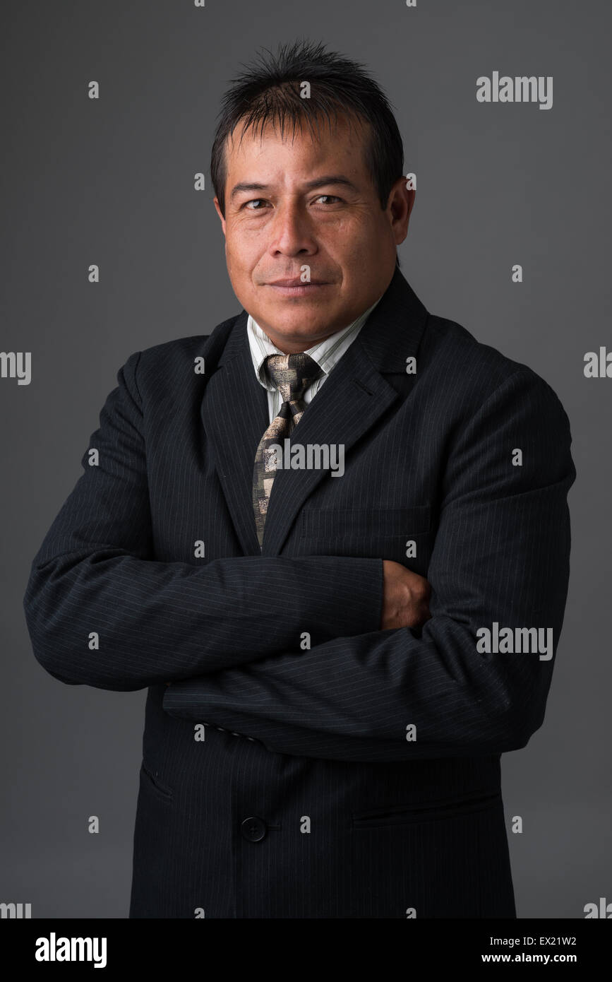 Hispanic business man smiling wearing a business suit posing for a ...