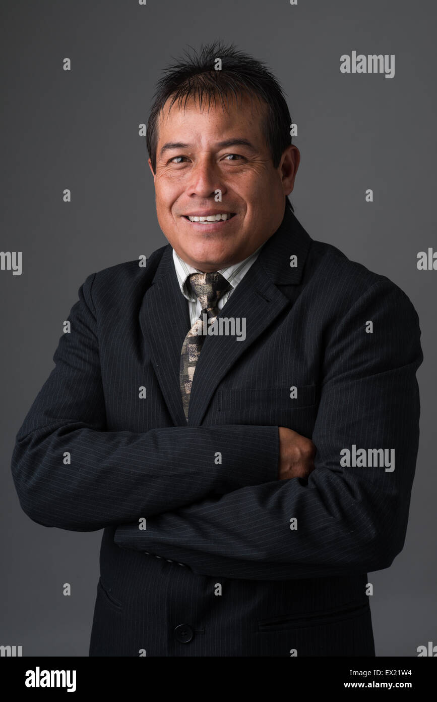 Hispanic business man smiling wearing a business suit posing for a ...